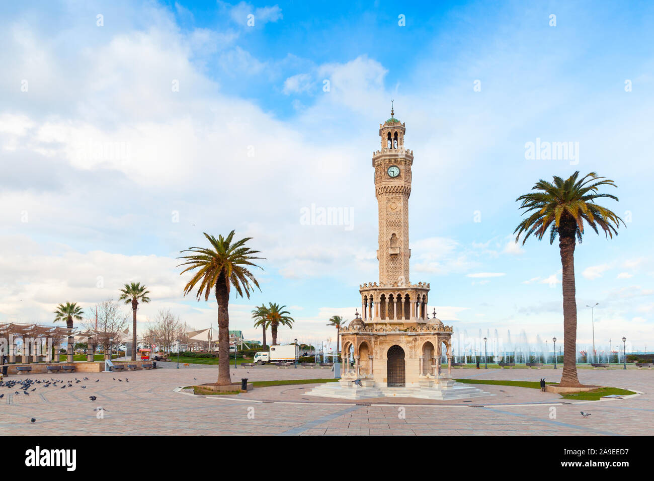 Konak Square view with palm trees and old clock tower, it was built in ...