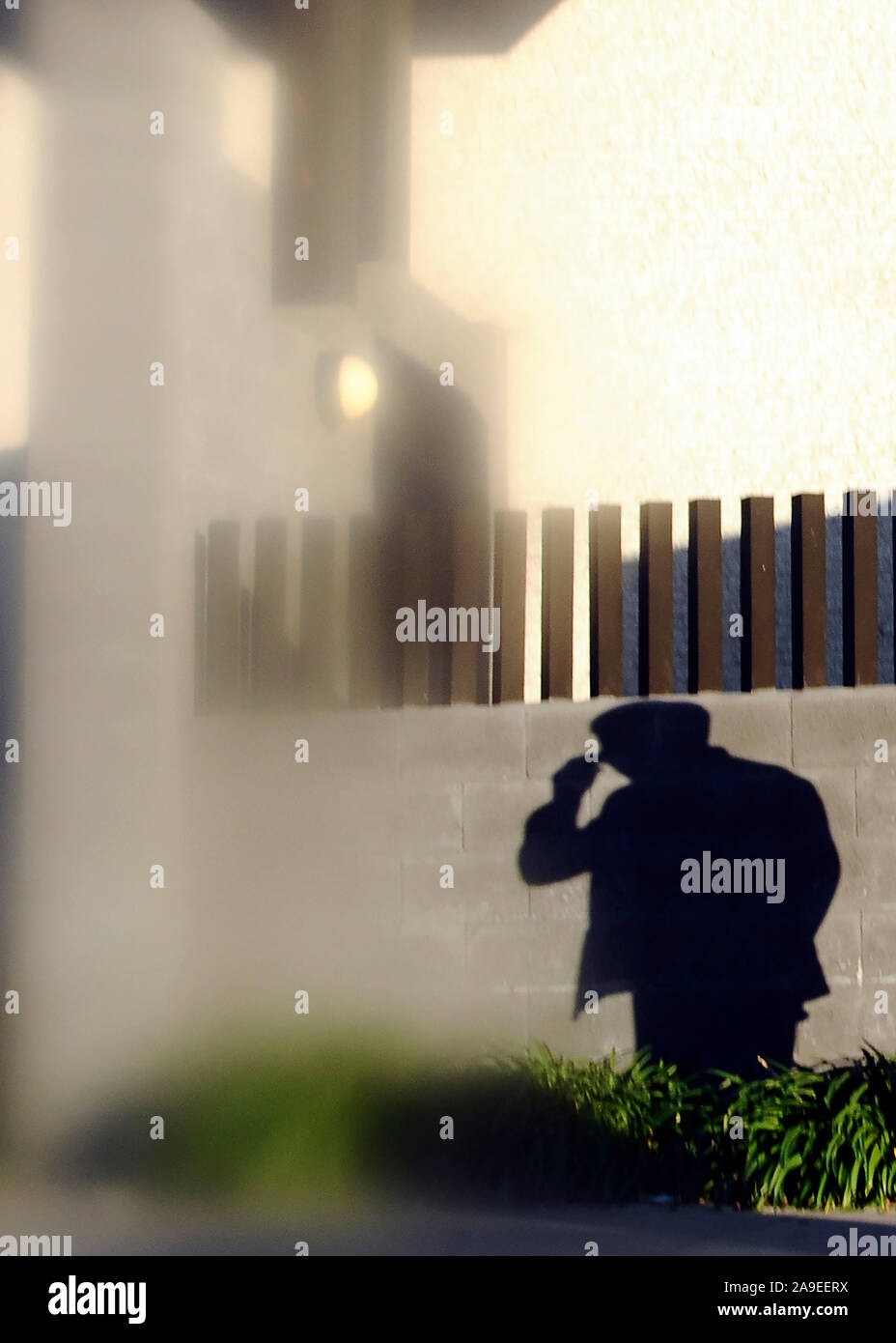 Shadow, man, wall, anonymous person, fence Stock Photo - Alamy
