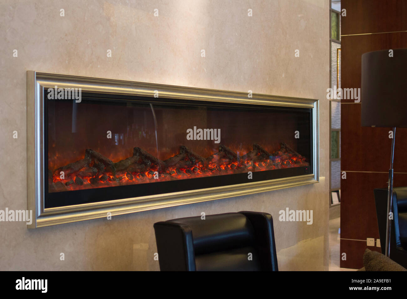 Tacky fake fire place with a picture frame Stock Photo - Alamy