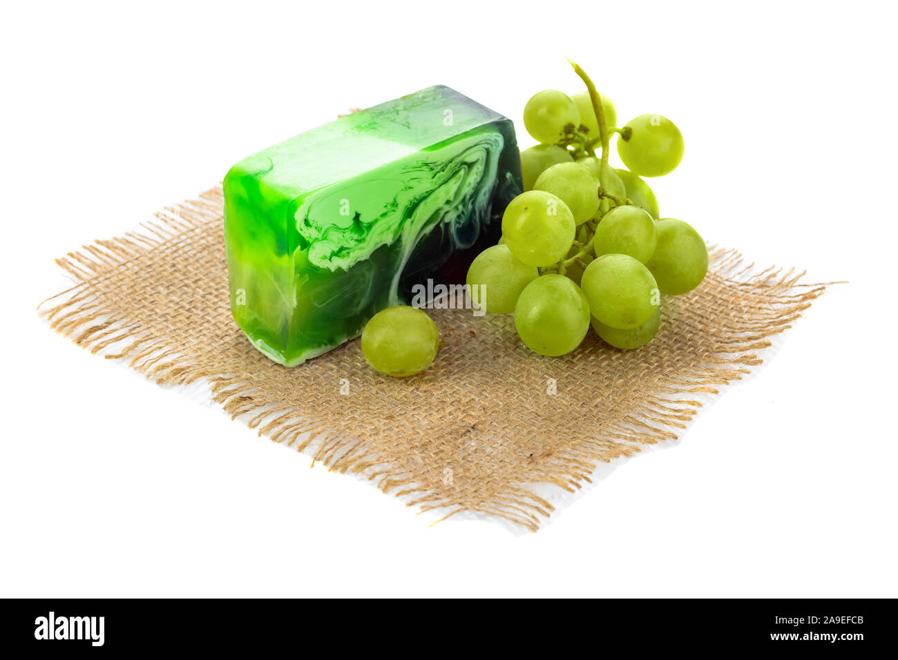 Handmade soap bar with green grapes. Organic soap. Spa treatments. Isolated on a white ...