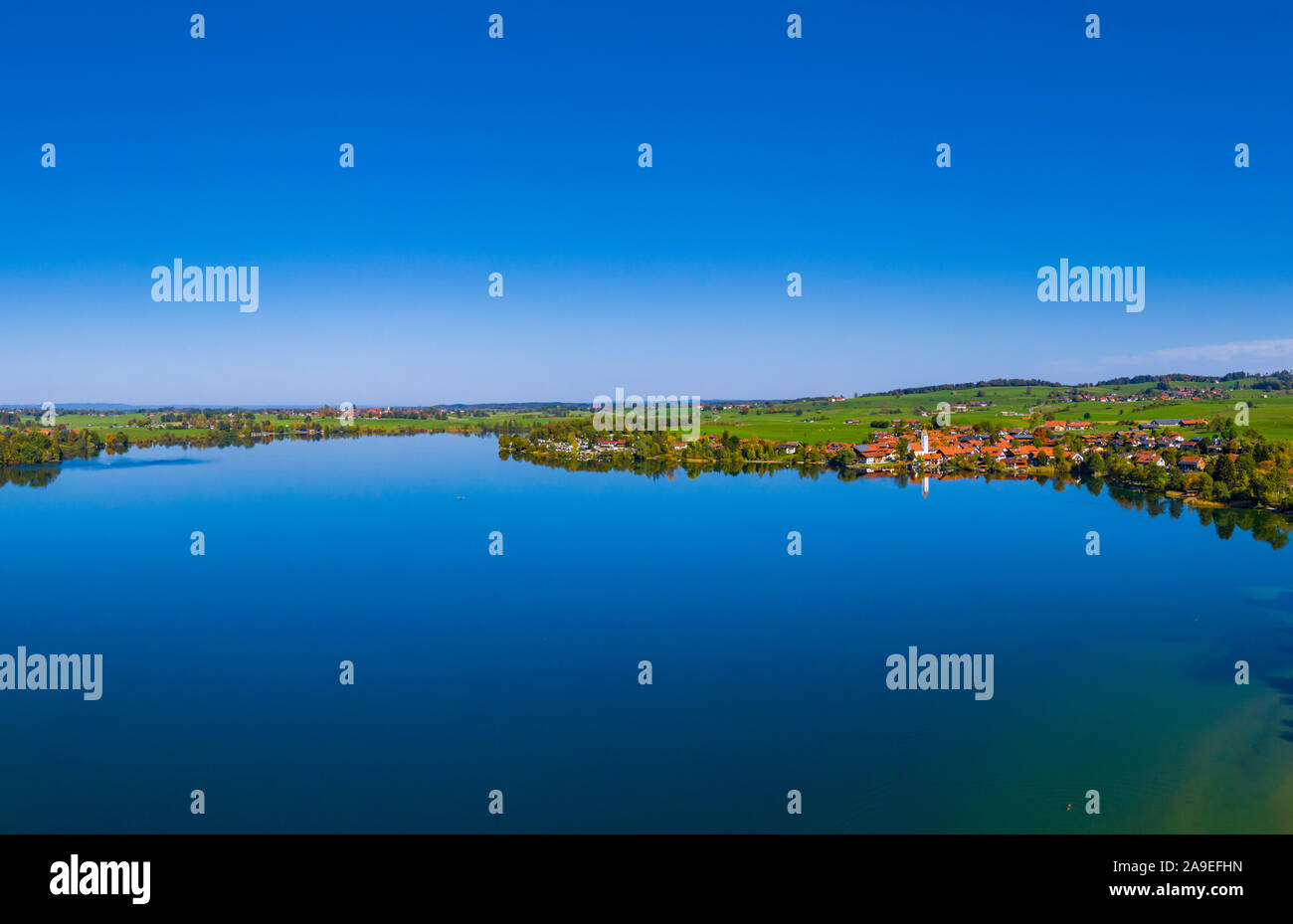Village of Riegsee on Lake Riegsee, Blaues Land region, Upper Bavaria ...