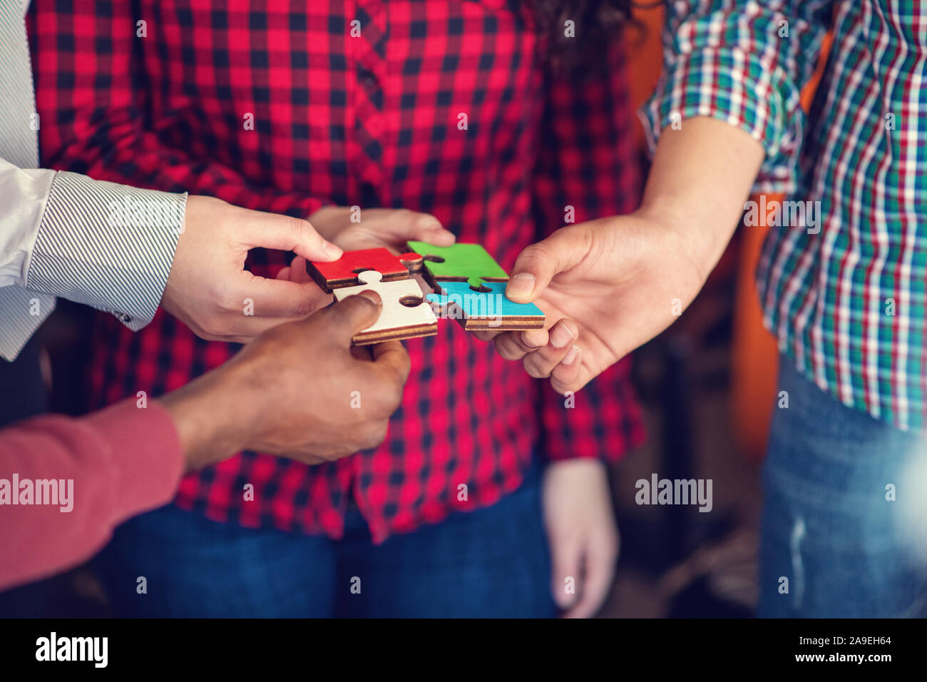 diverse business team solving puzzle concept together Stock Photo - Alamy