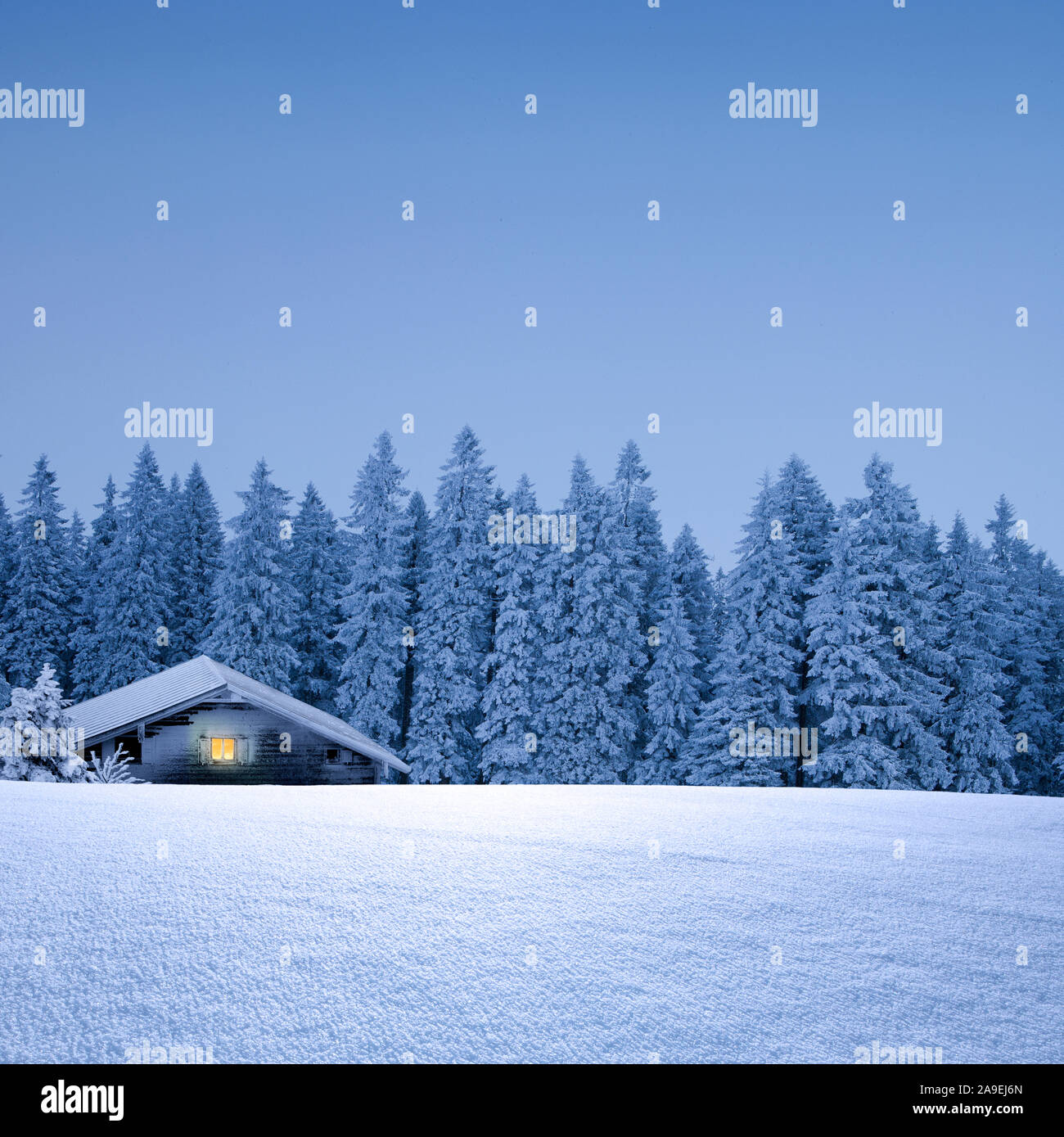 Ski lodge with shining window Stock Photo - Alamy