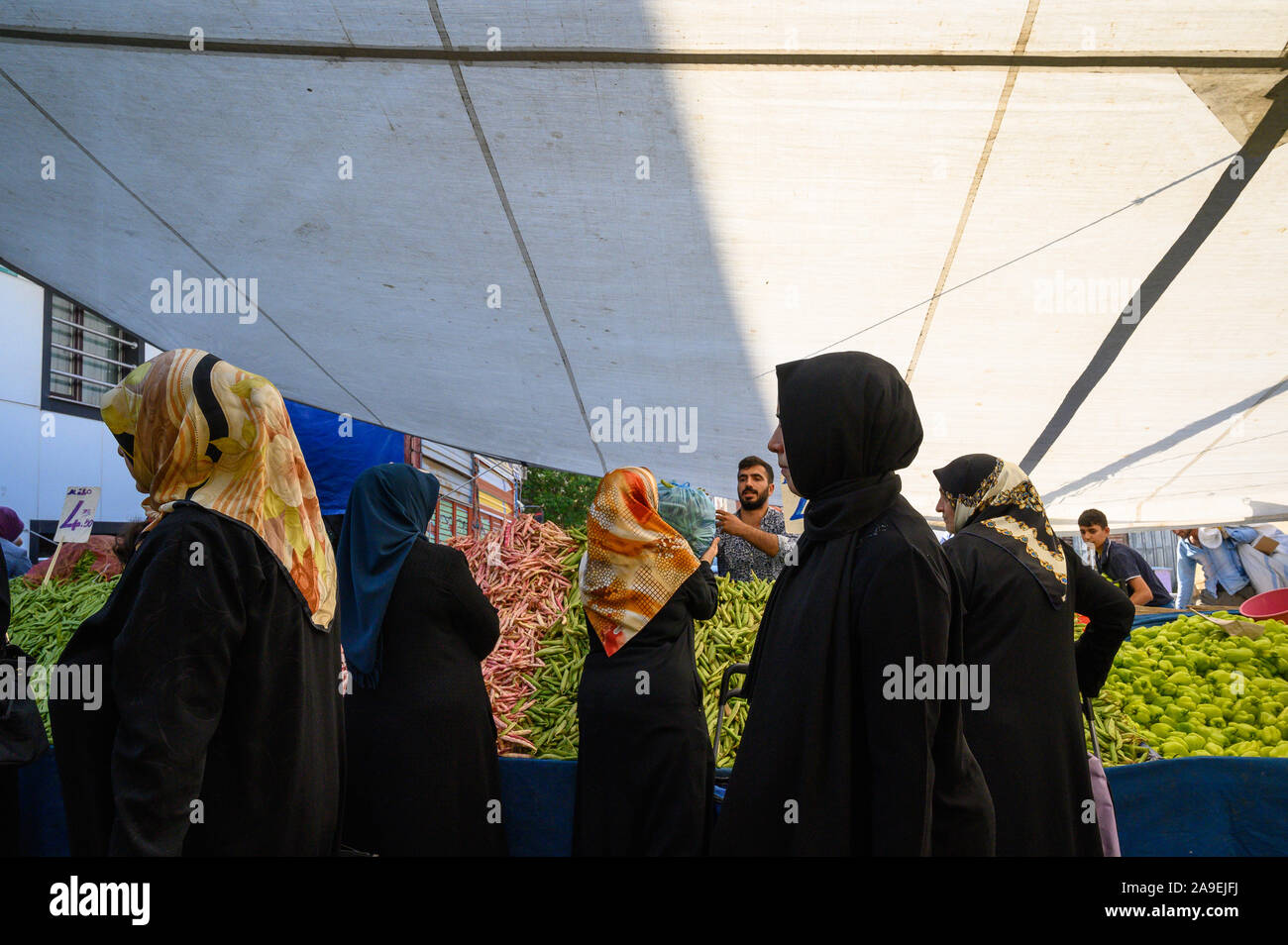 Muslim women under a tarp at the Monday Market, Istanbul, Turkey Stock ...