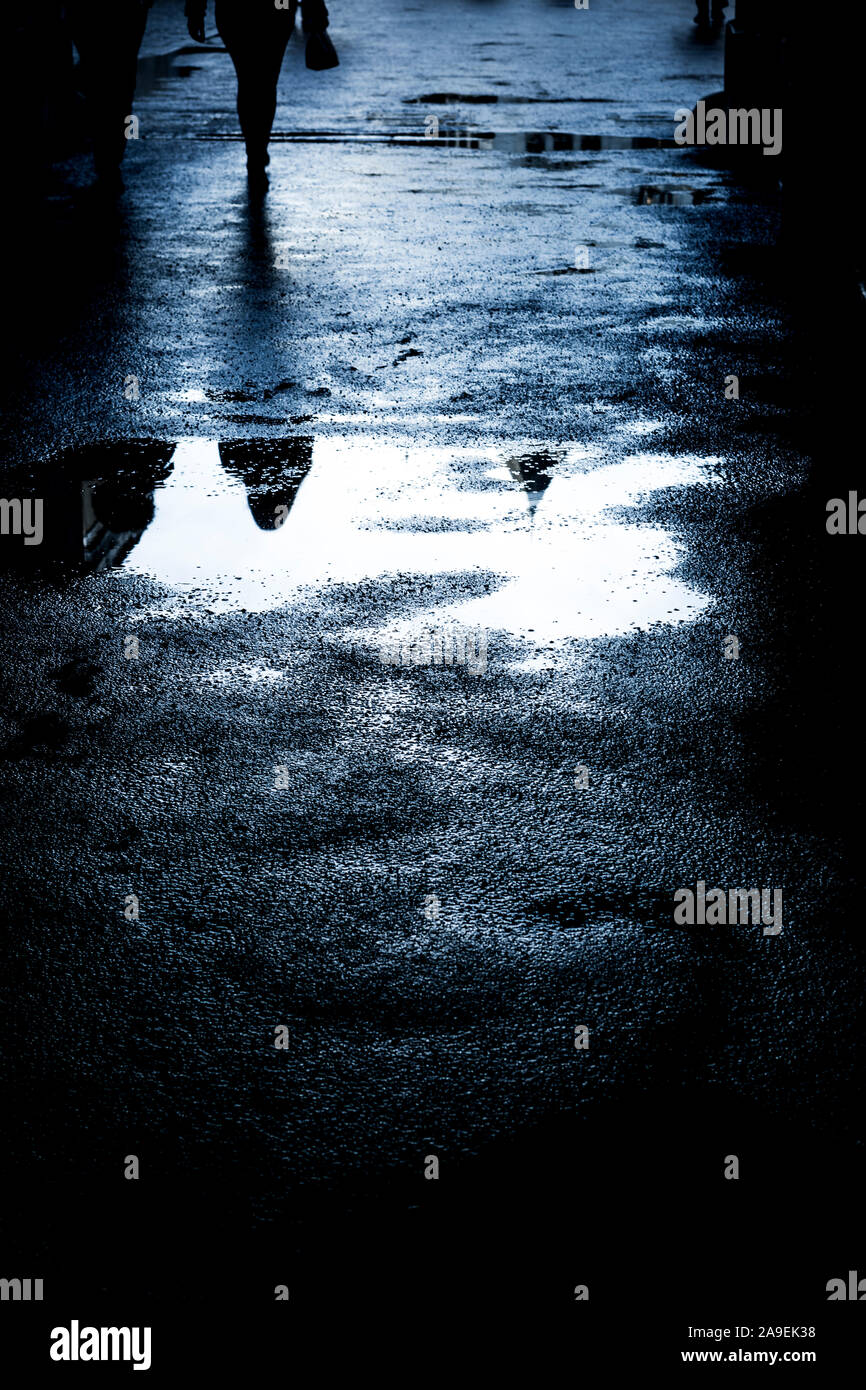 Reflection in a puddle of water Stock Photo - Alamy