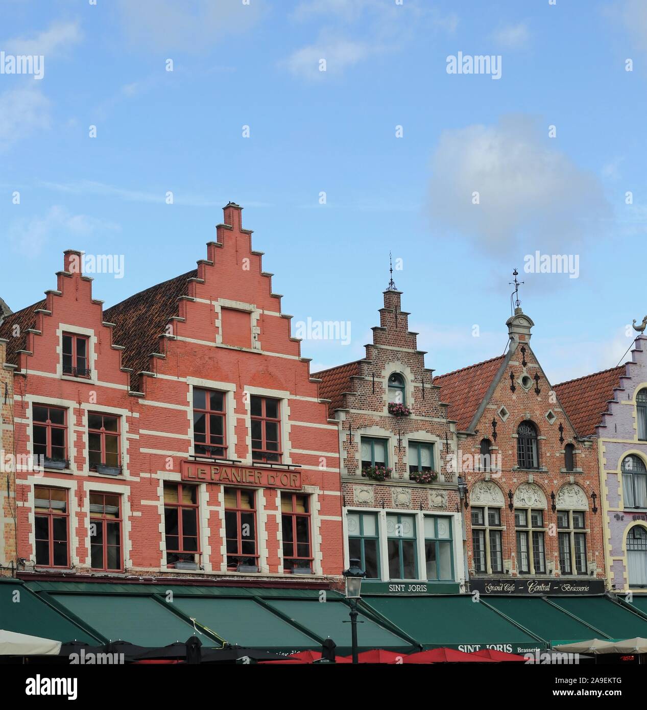traditional colorful Belgian facades of houses at Market square in city ...