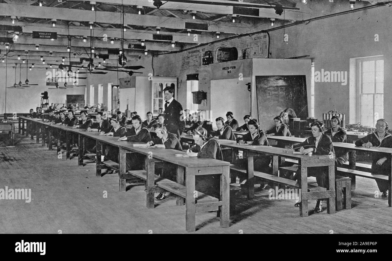 1918 or 1919 - U.S. Navy sailors in a classroom wearing headphones ...