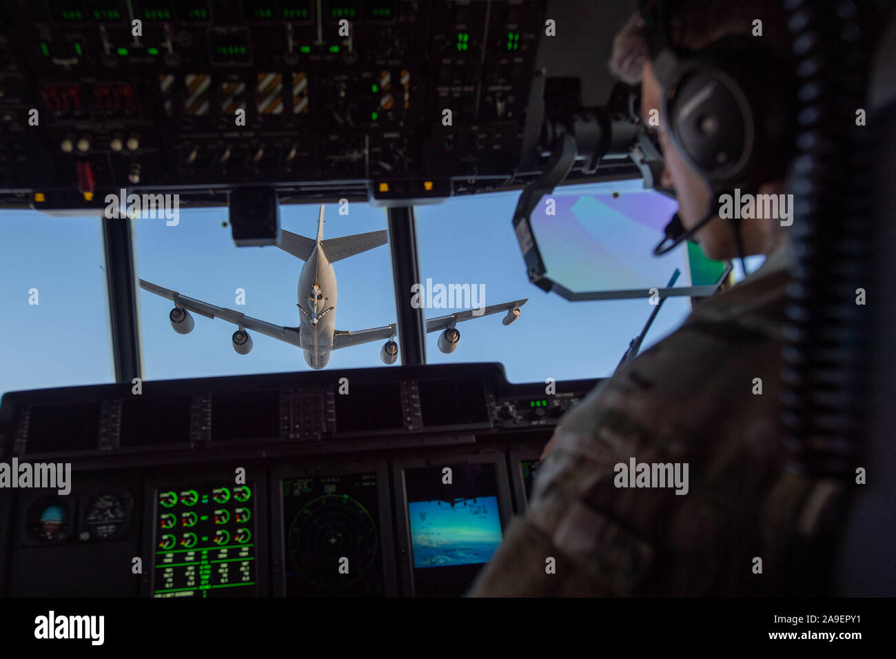 Flight crew in the cockpit of a US Air Force MC-130J Commando II from ...