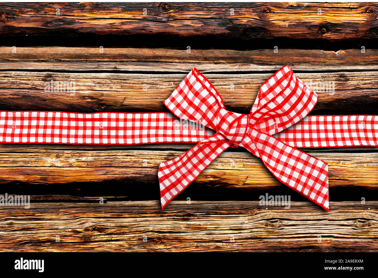 Checkered loop in front of wood background Stock Photo - Alamy