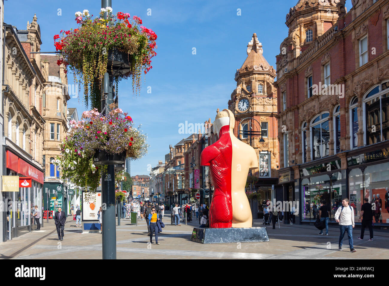Sculpture flower baskets busy crowded shops buskers retailers pe hi-res ...