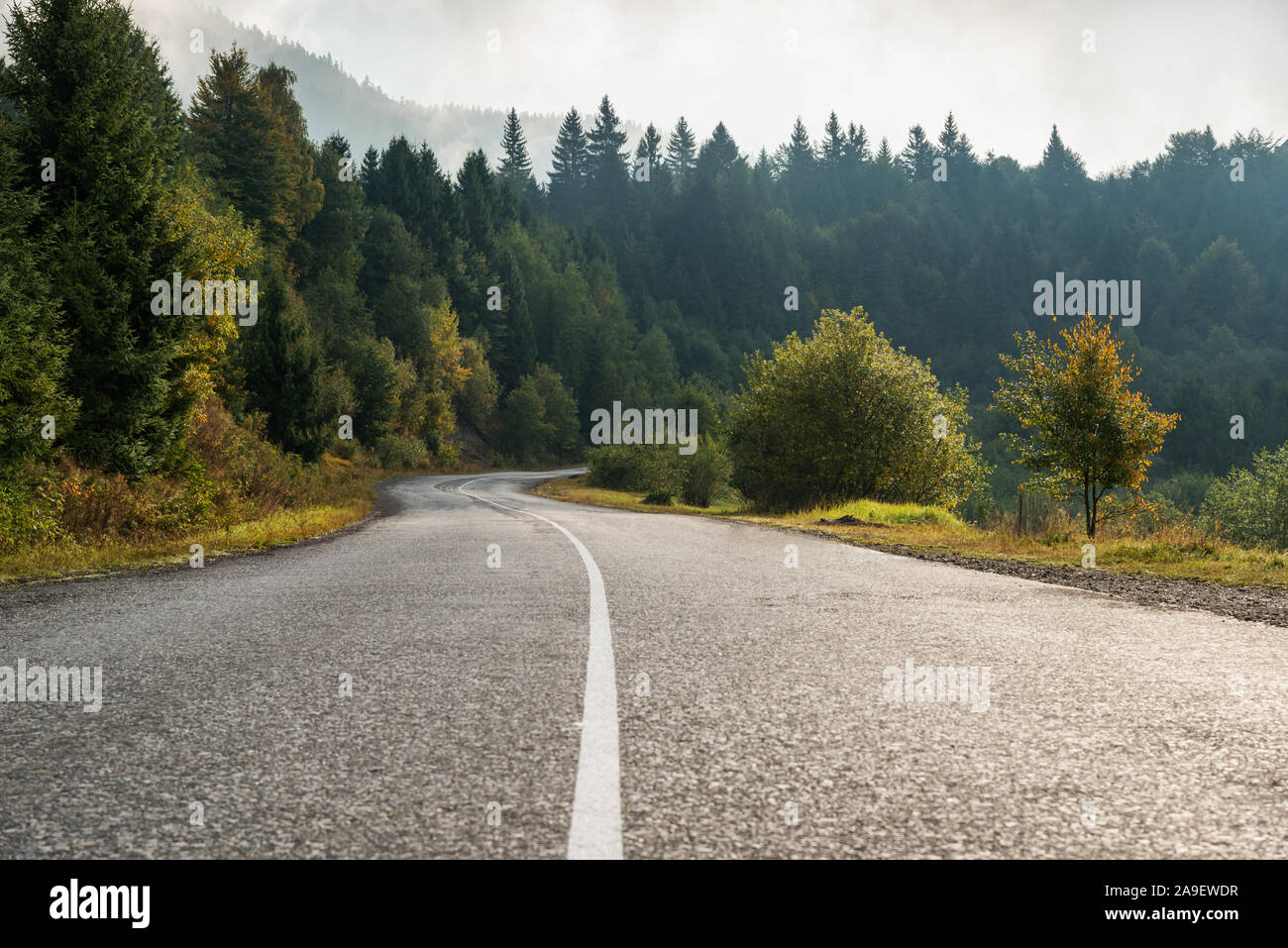 Empty road into mountains hi-res stock photography and images - Alamy