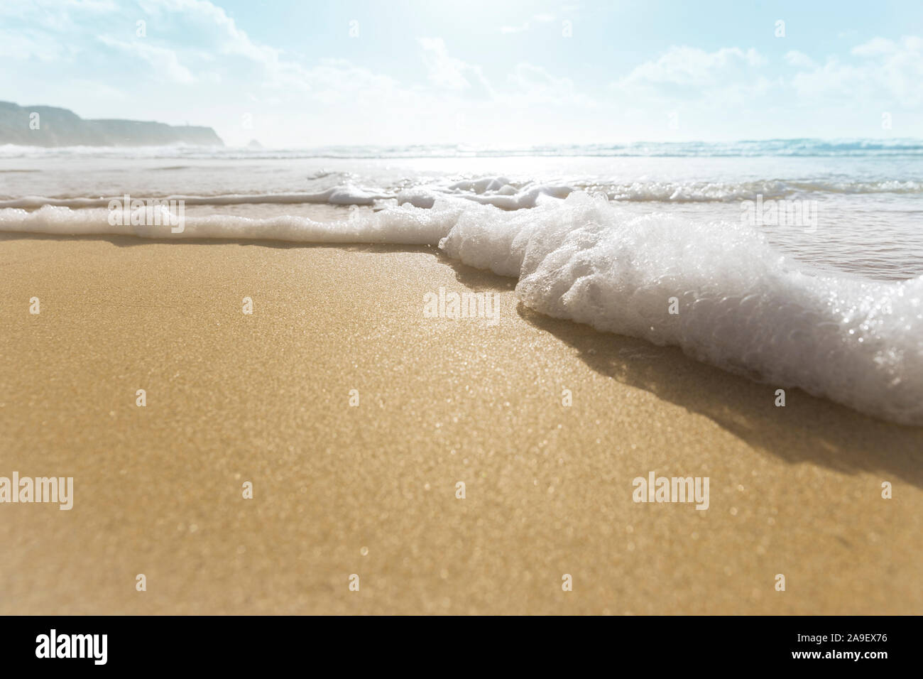 Wave on the beach Stock Photo - Alamy