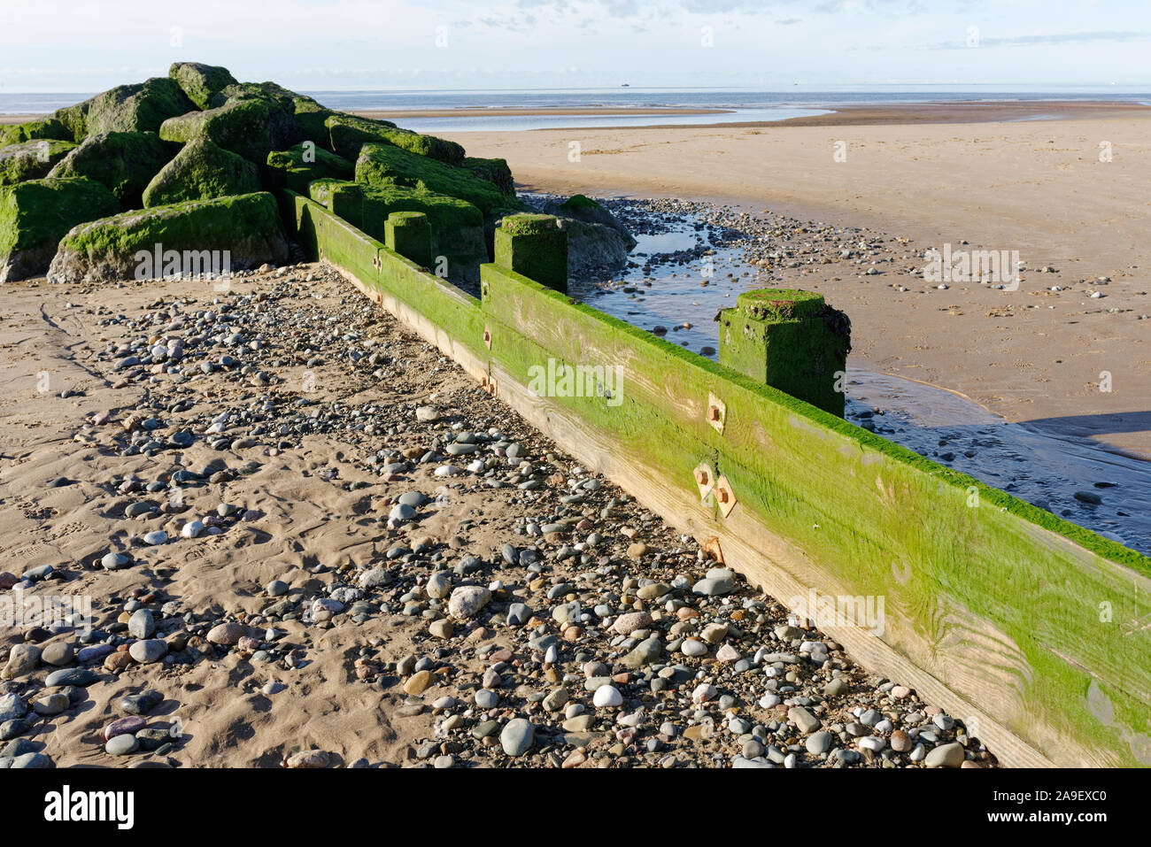 Wooden groyne with algal growth and rock groyne extension on rossall ...