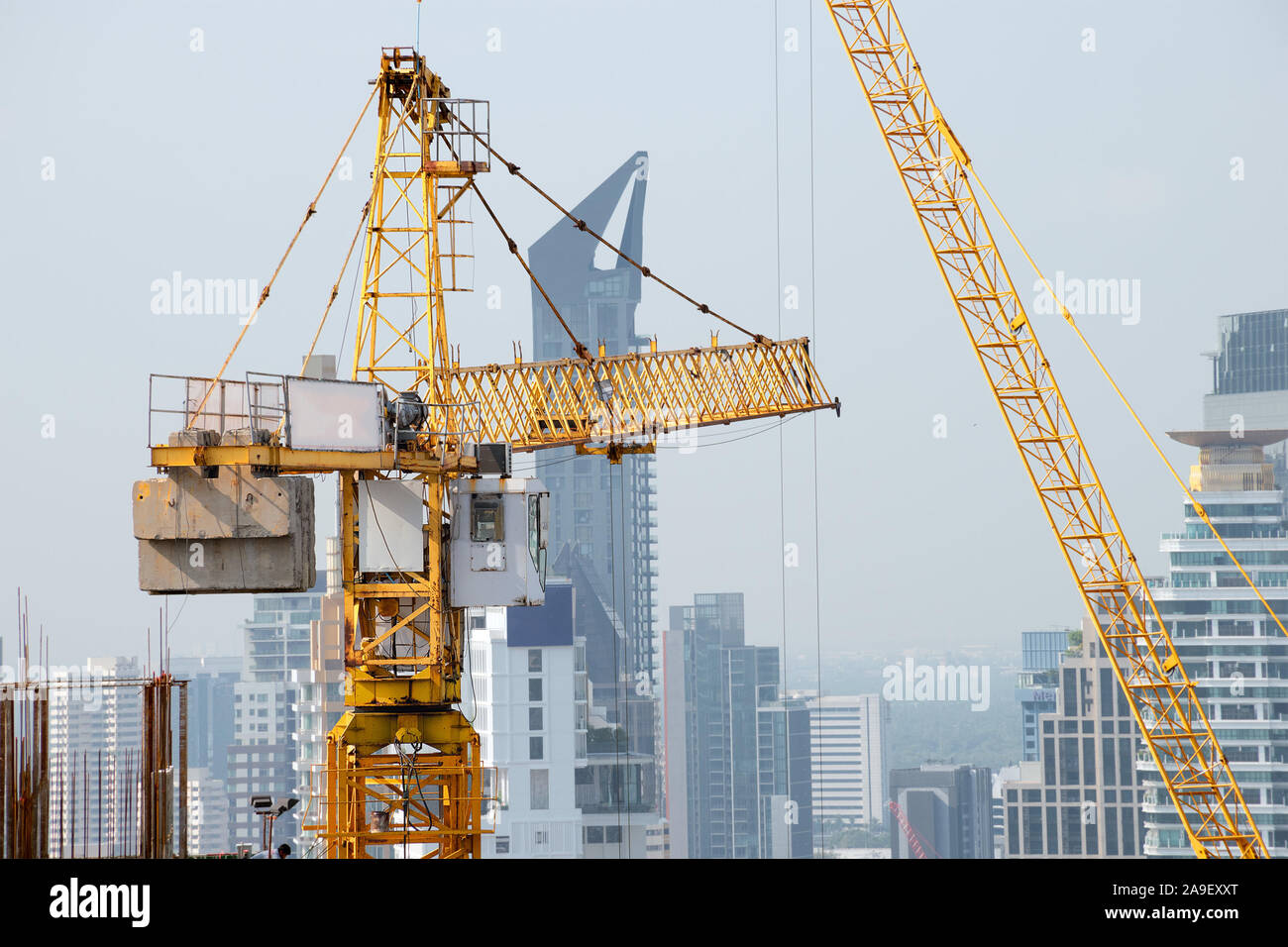 Aerial view of a building construction with tower crane, scaffolding ...