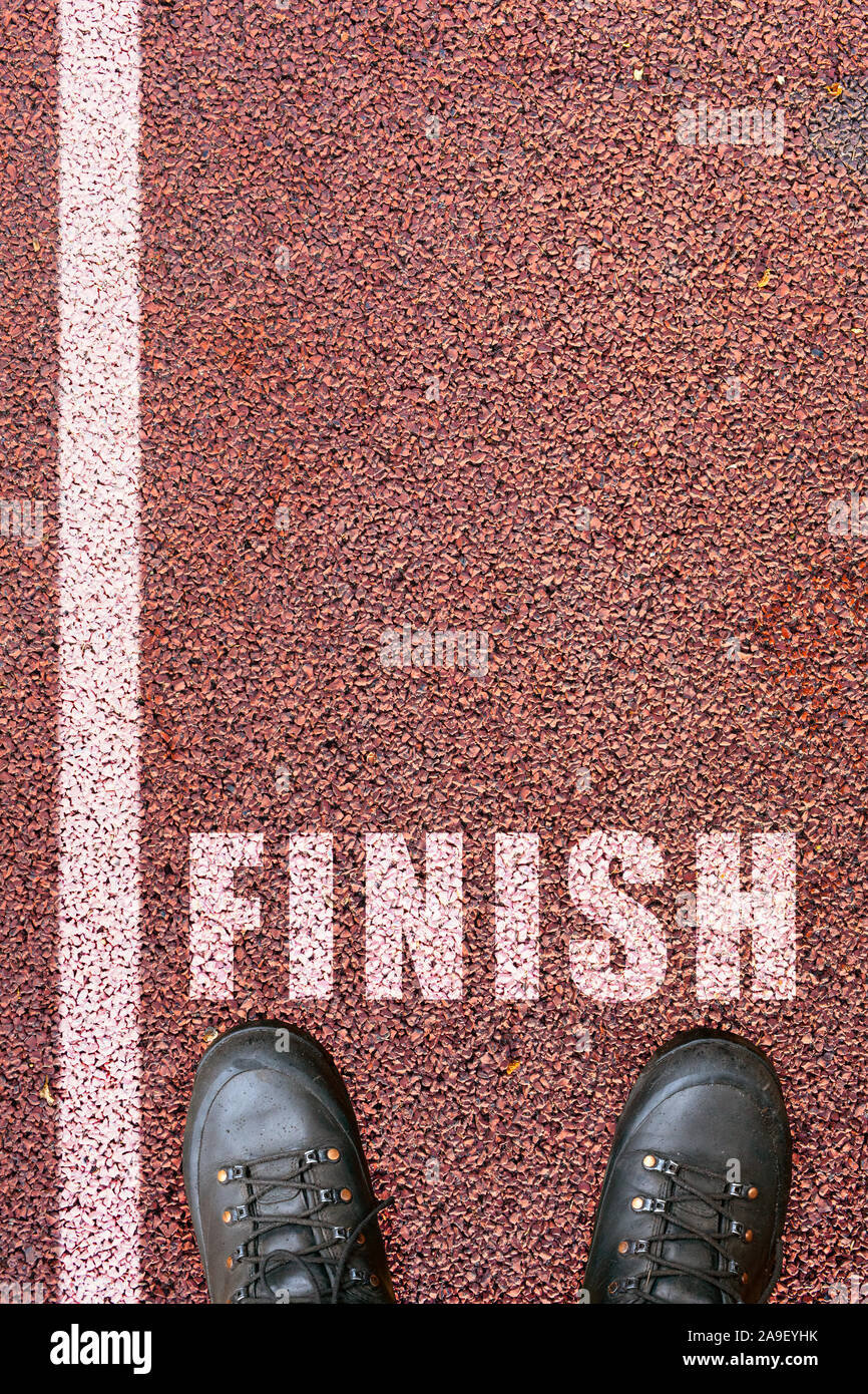 male legs and shoes standing to finishing line. top view. Finish line ...