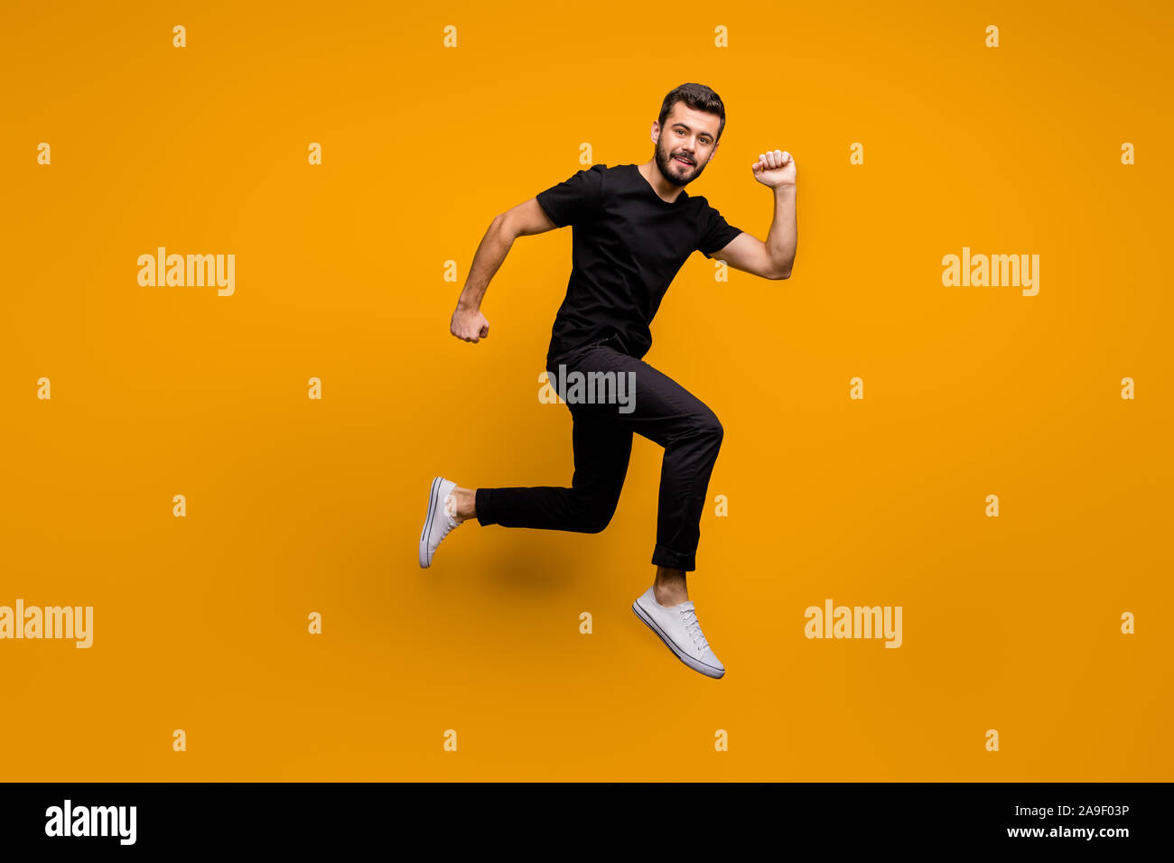 Full length profile photo of handsome millennial guy jumping high rush ...