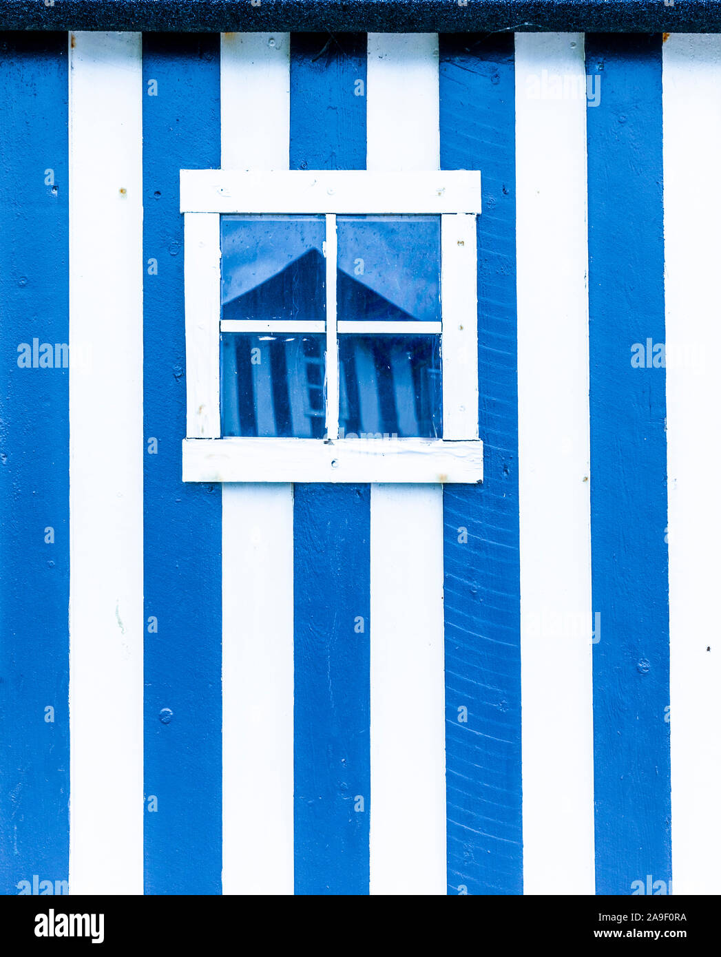 Blue stripy beach huts hi-res stock photography and images - Alamy