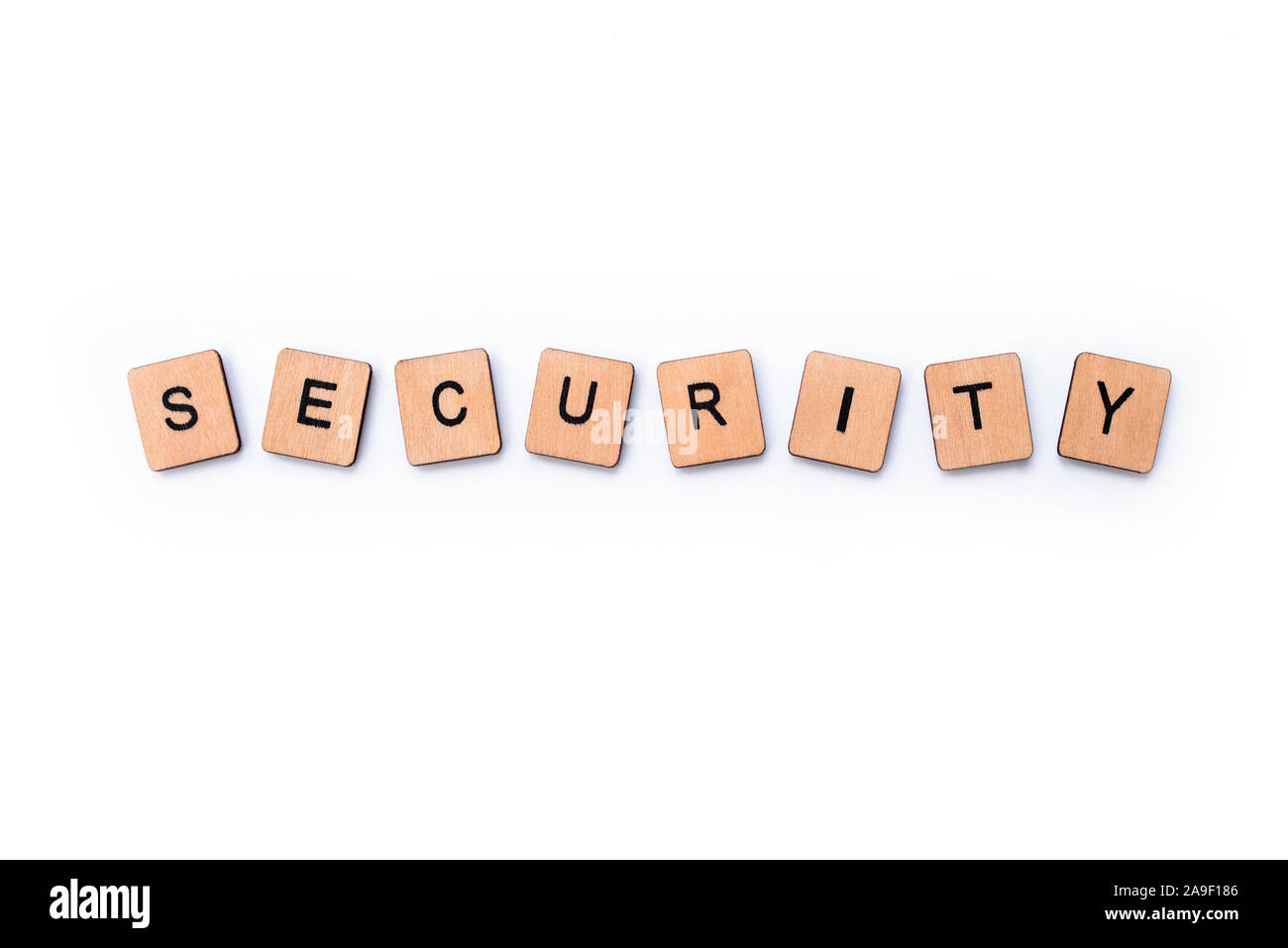 The word SECURITY, spelt with wooden letter tiles over a white ...