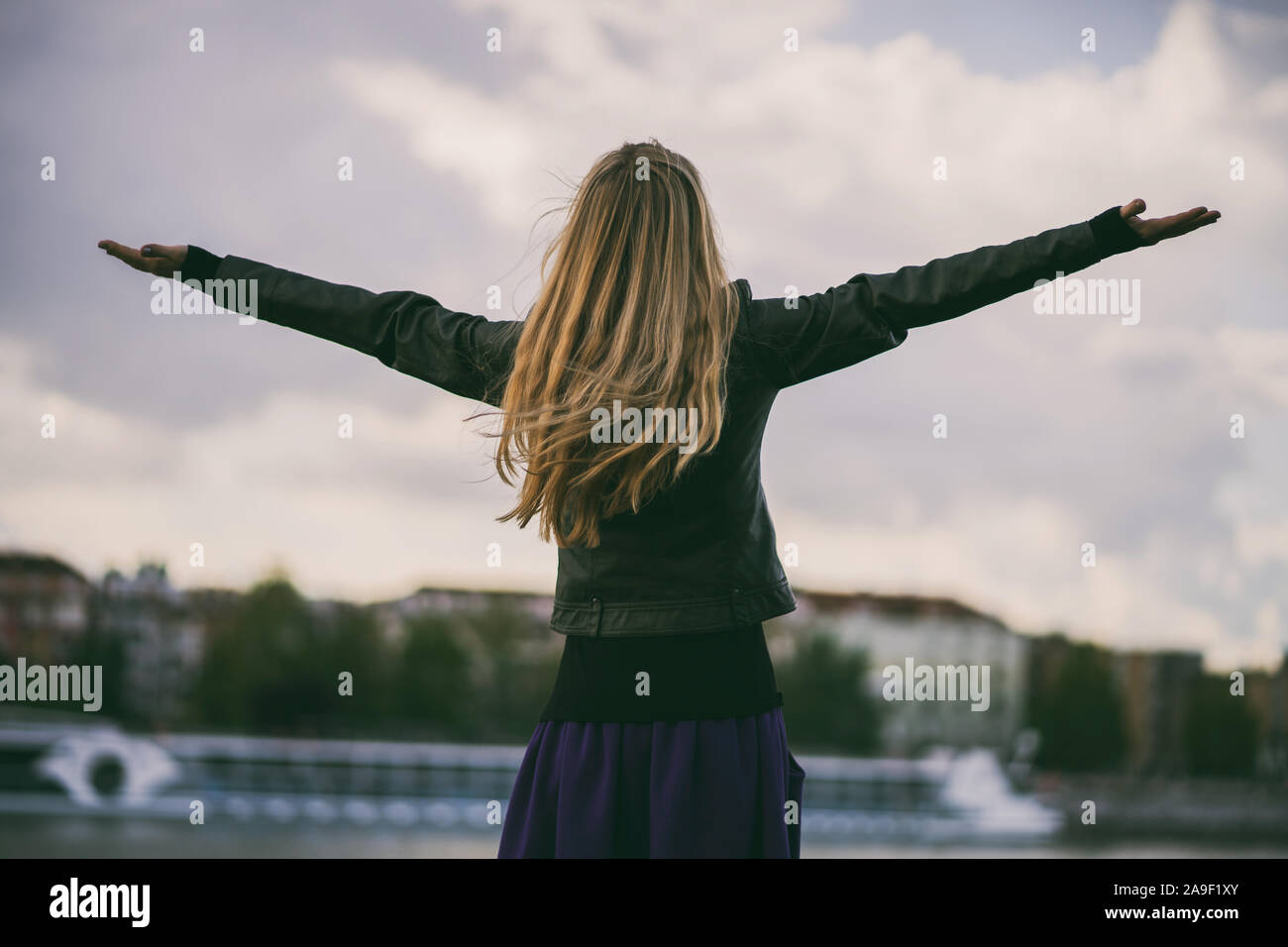 Woman enjoying fresh air after rain Stock Photo - Alamy