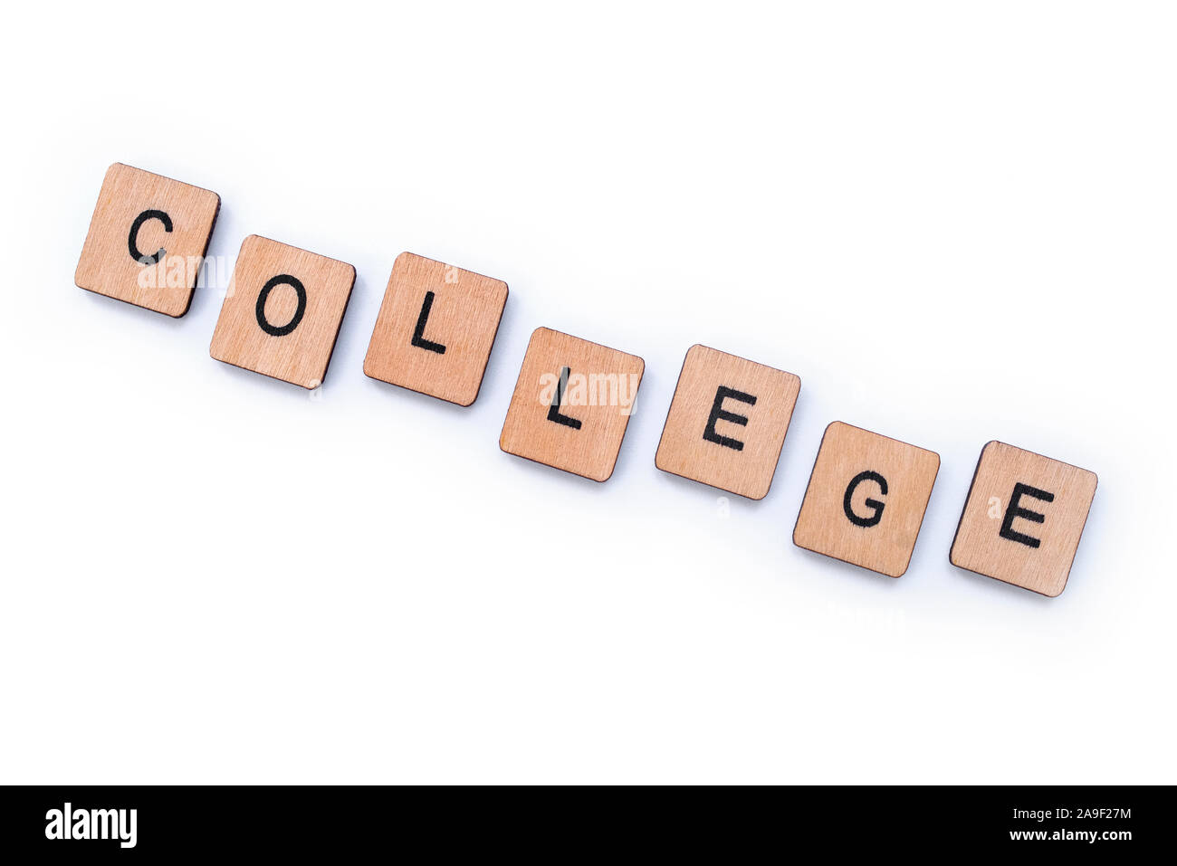 The word COLLEGE, spelt with wooden letter tiles over a white ...