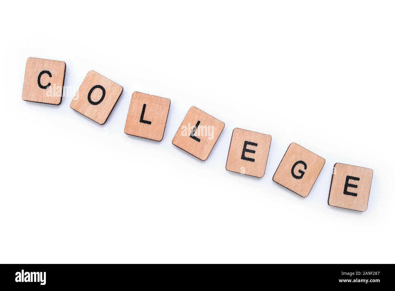 The word COLLEGE, spelt with wooden letter tiles over a white ...