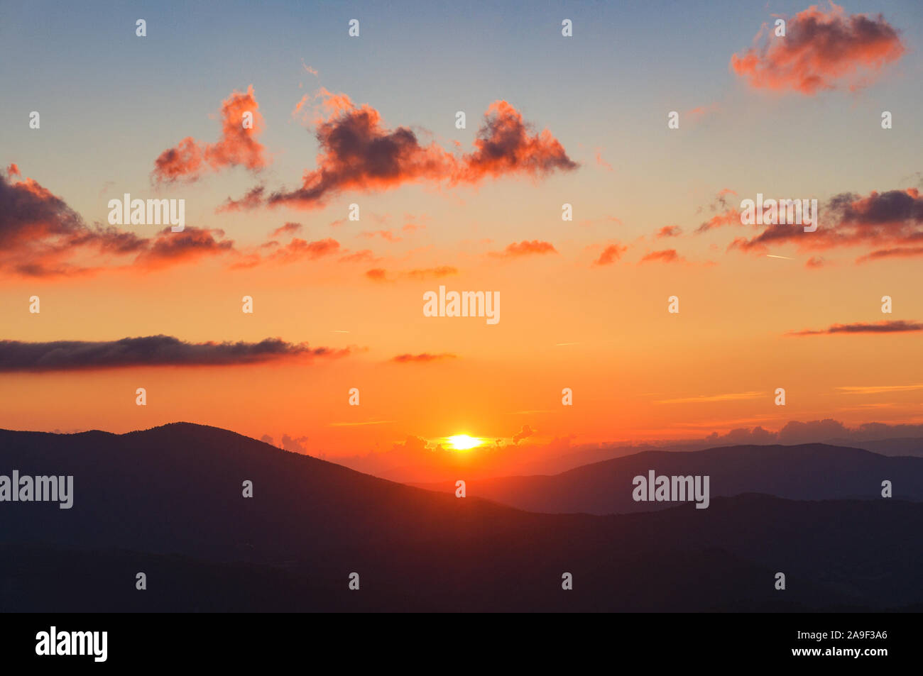 Sun over mountains hi-res stock photography and images - Alamy