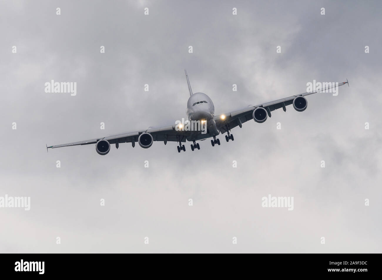 Passenger airliner approaching for landing in bad weather Stock Photo ...