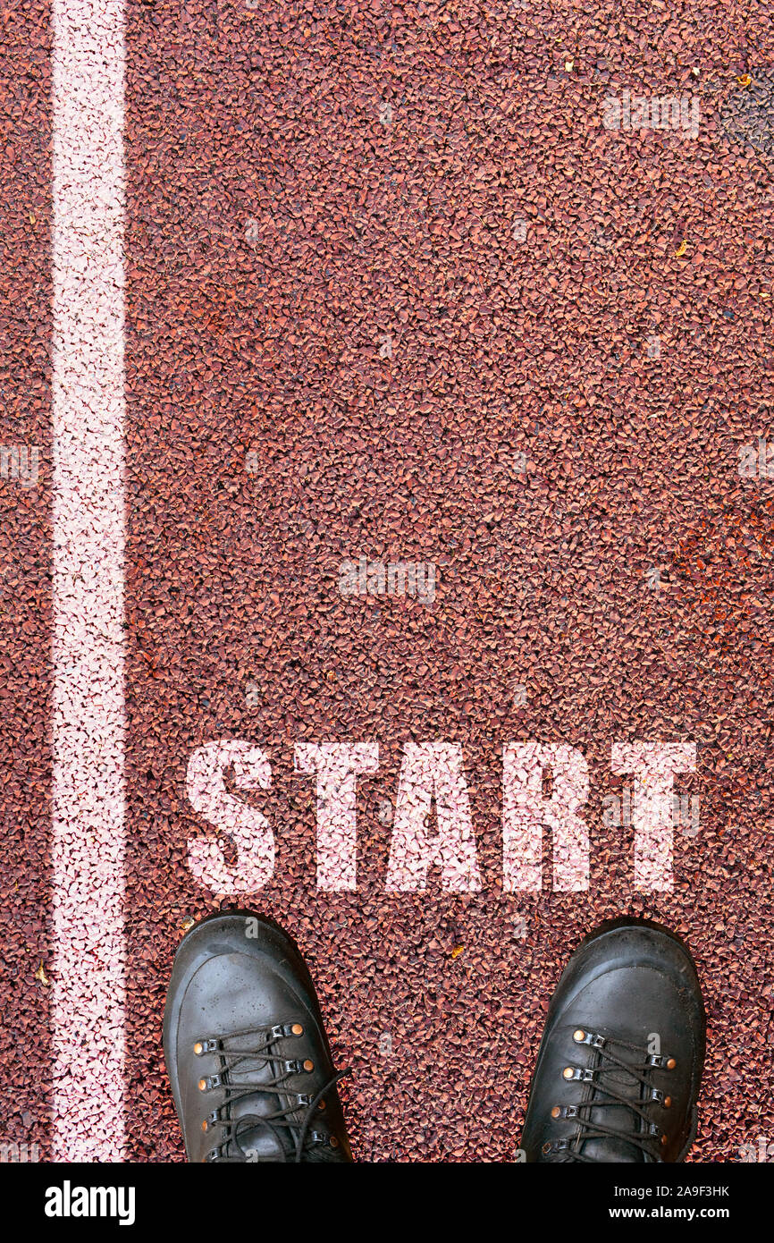 male legs and shoes standing to starting line. top view. Start line on ...