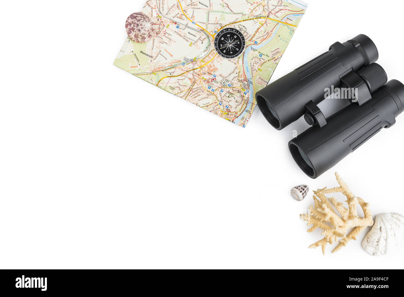 Travel planing: map, compass and binoculars Stock Photo - Alamy