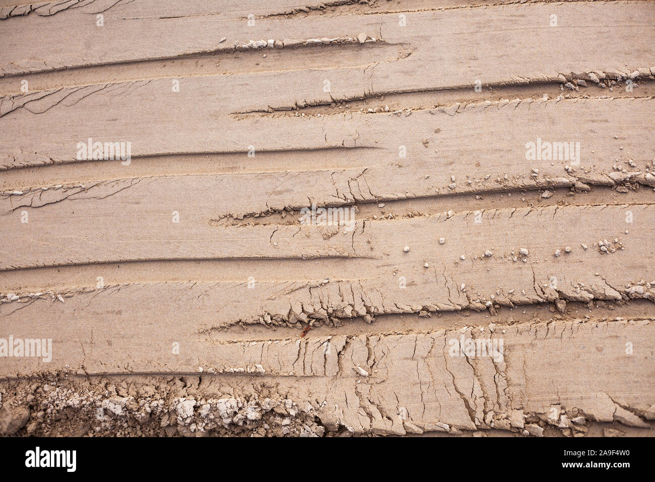 Tire tread marks. Footprints in the sand from a bulldozer. Sand texture ...