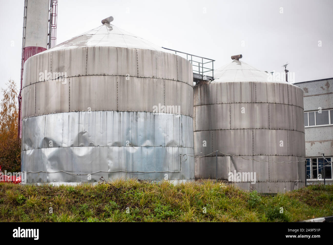 The work of the boiler room. Large tanks with fuel. Metal storage ...