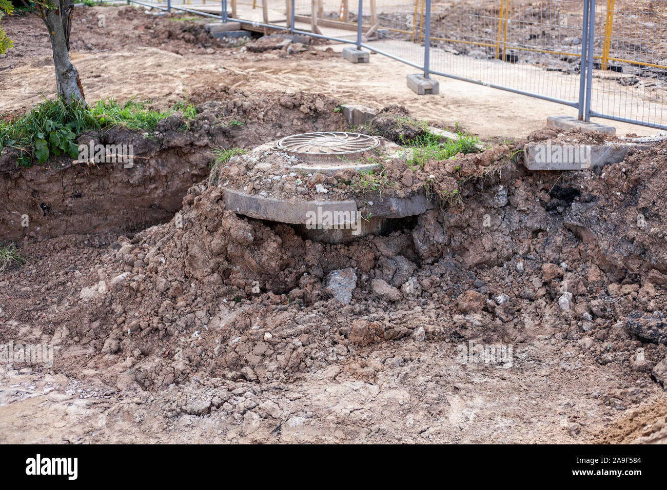 Sewerage repair at a residential building. Access hatch for water ...