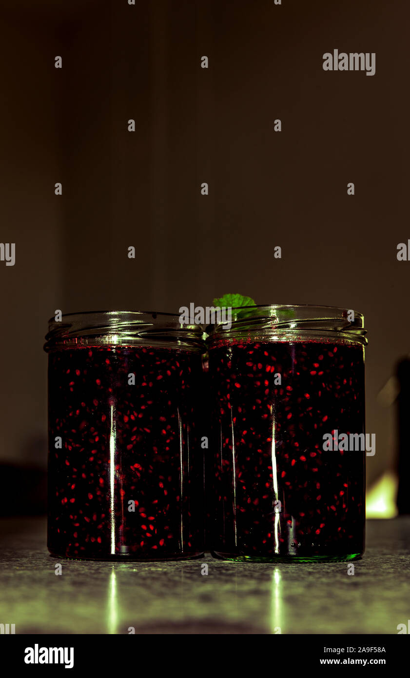 Blackberry jam in front of a dark background Stock Photo - Alamy
