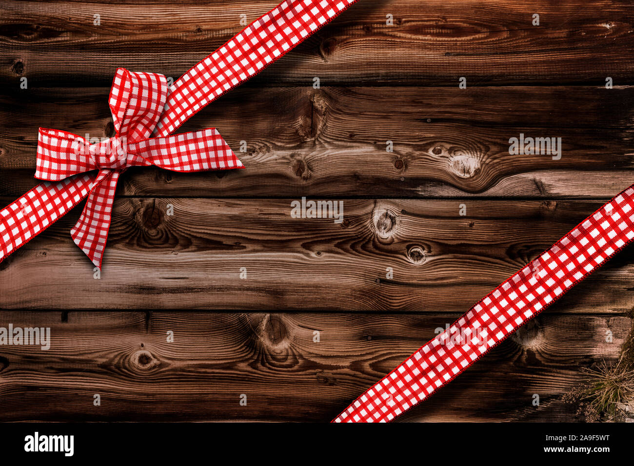 Checkered loop in front of wood background Stock Photo - Alamy