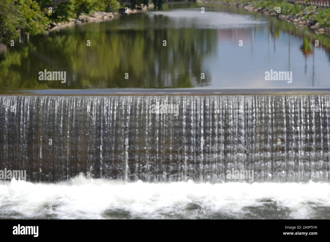 Waterfall and still river Stock Photo - Alamy