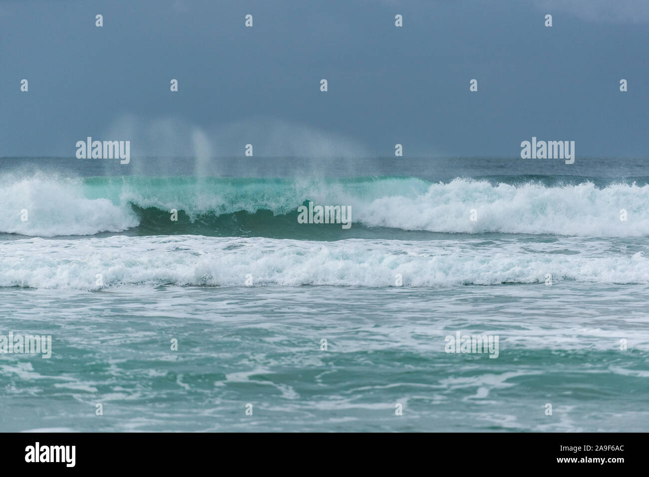 Stormy weather with high waves and grey sky over ocean Stock Photo - Alamy