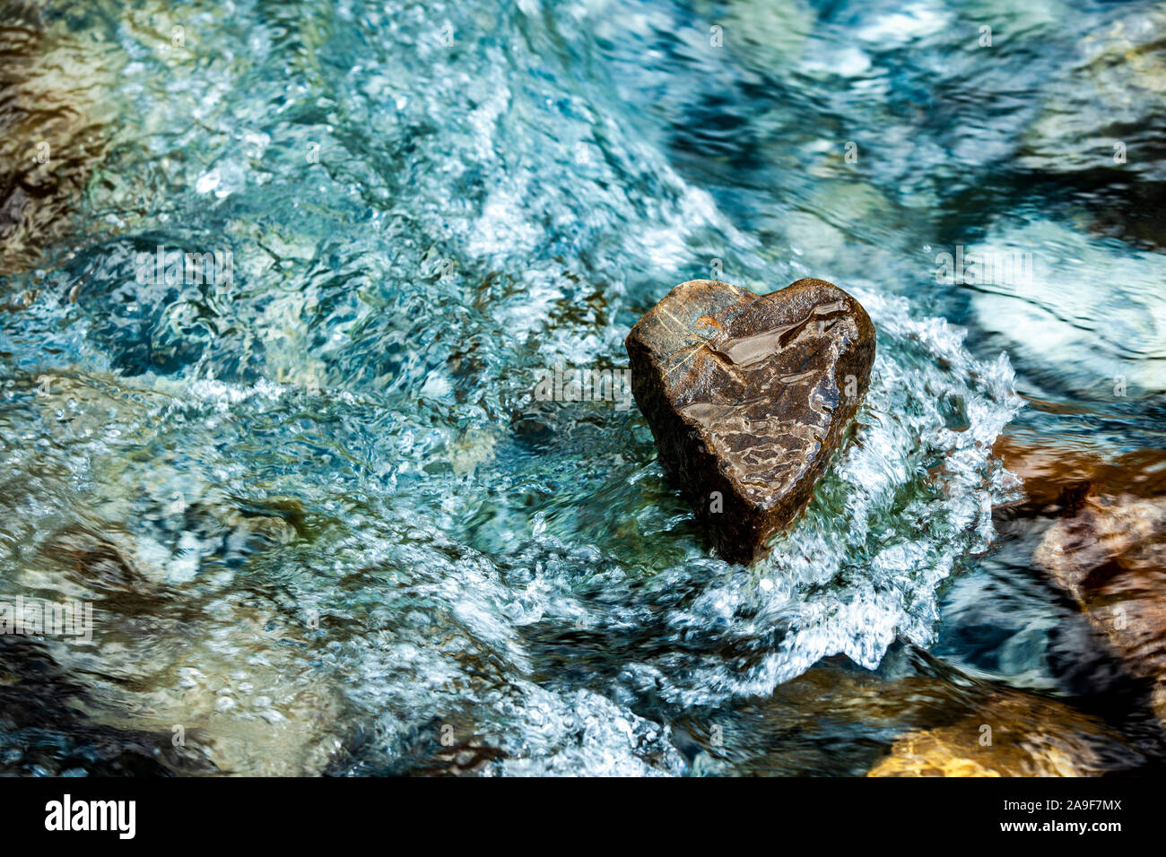 Pebble heart in water hi-res stock photography and images - Alamy