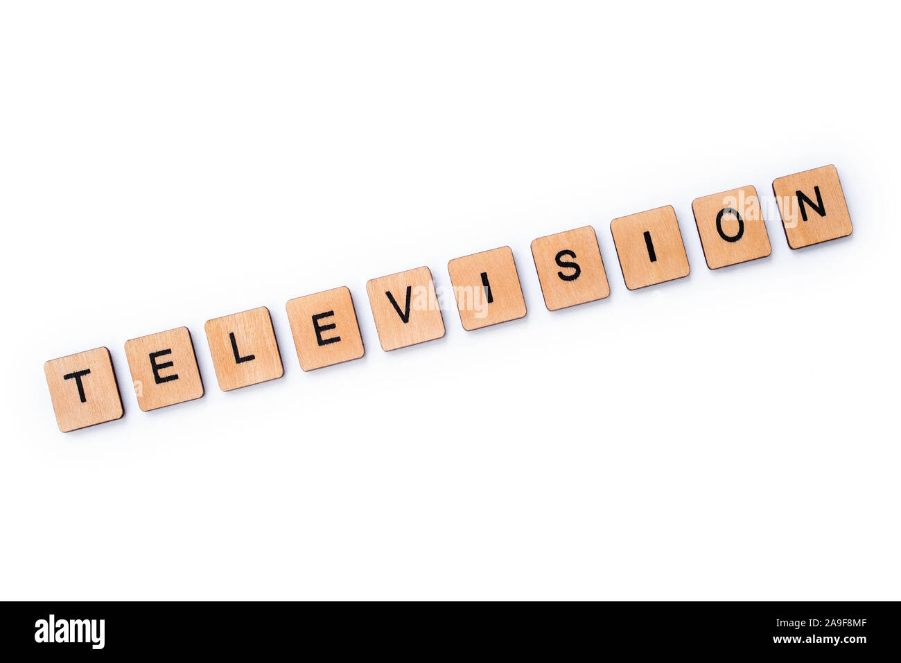 The word Television, spelt with wooden letter tiles over a white ...