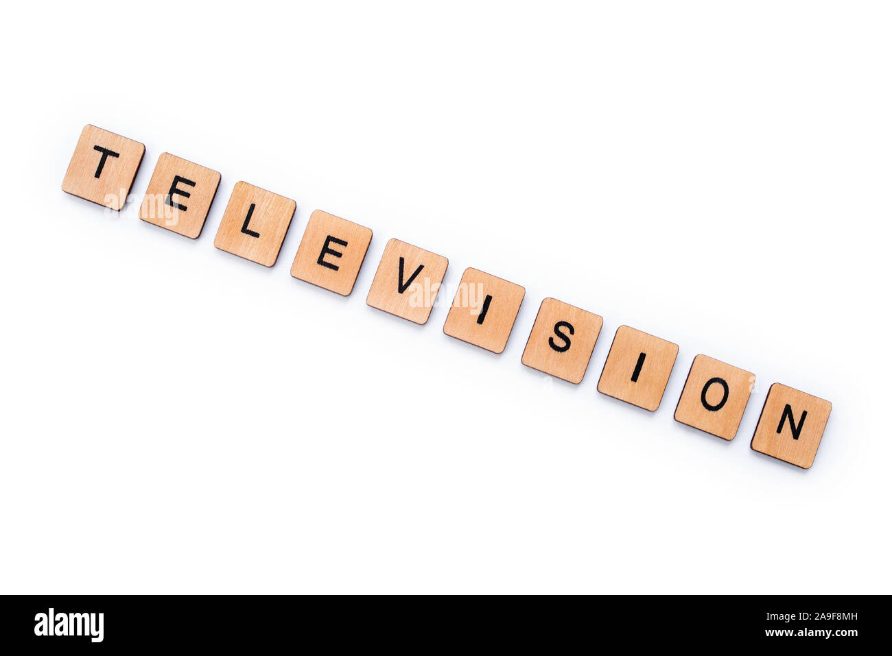 The word Television, spelt with wooden letter tiles over a white ...