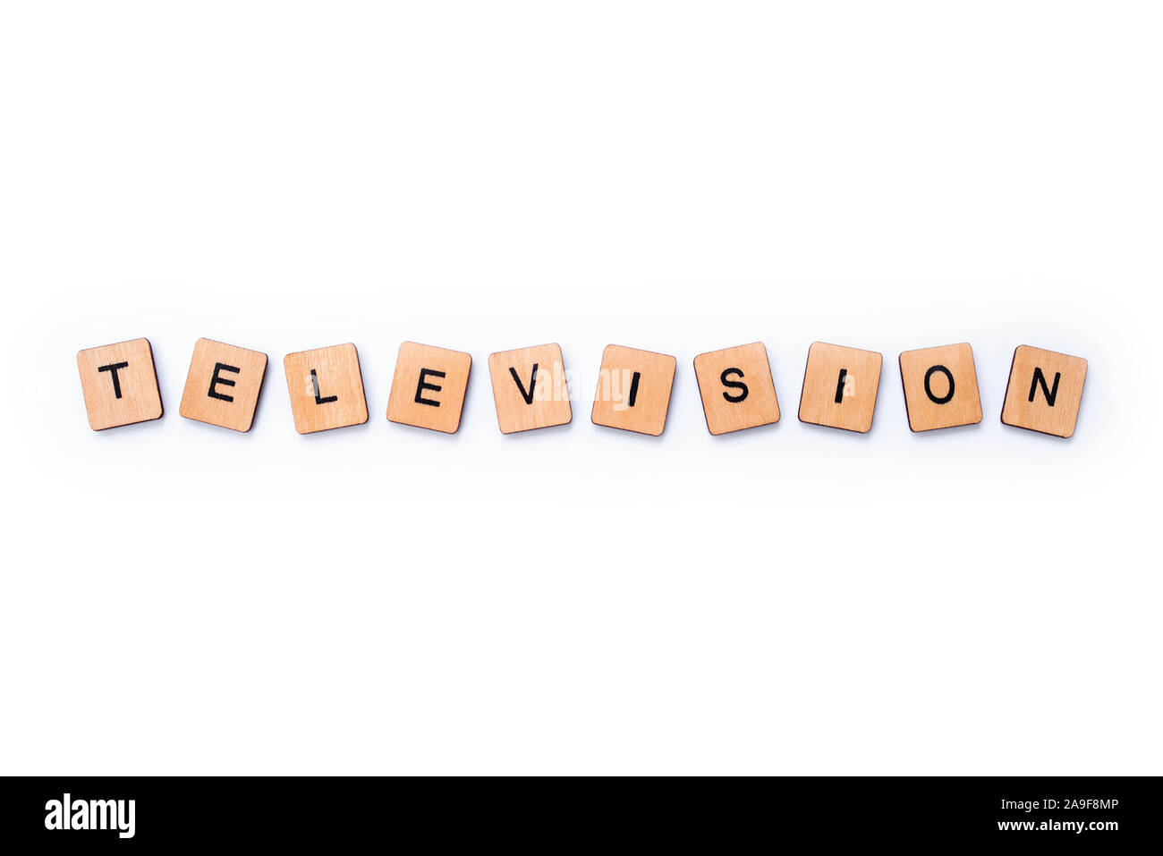 The word Television, spelt with wooden letter tiles over a white ...