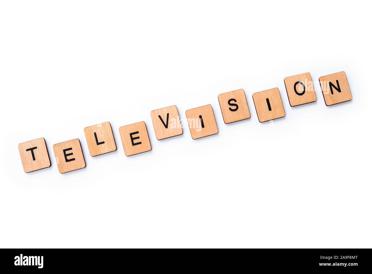 The word Television, spelt with wooden letter tiles over a white ...