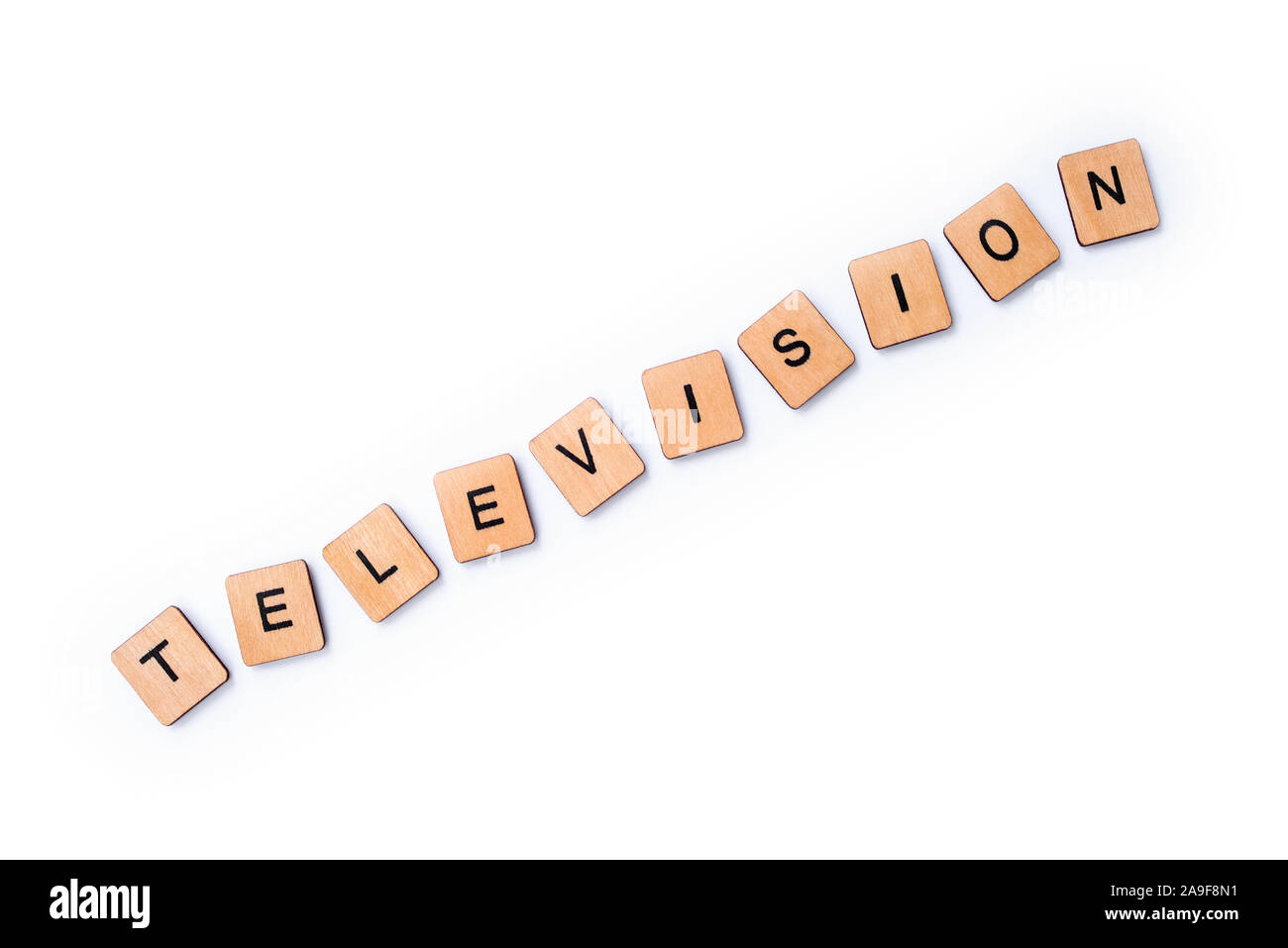 The word Television, spelt with wooden letter tiles over a white ...
