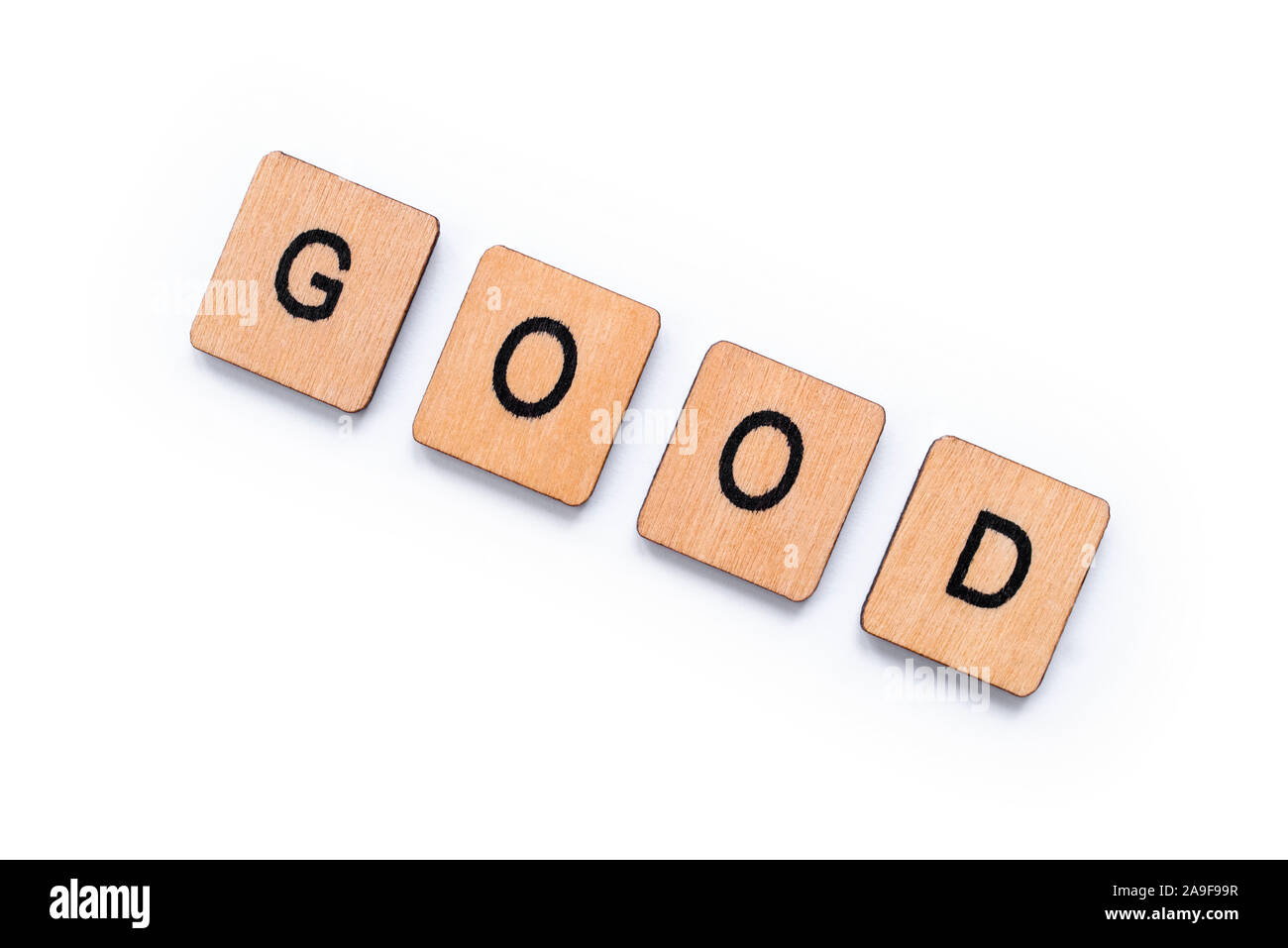 The word GOOD, spelt with wooden letter tiles over a white background ...