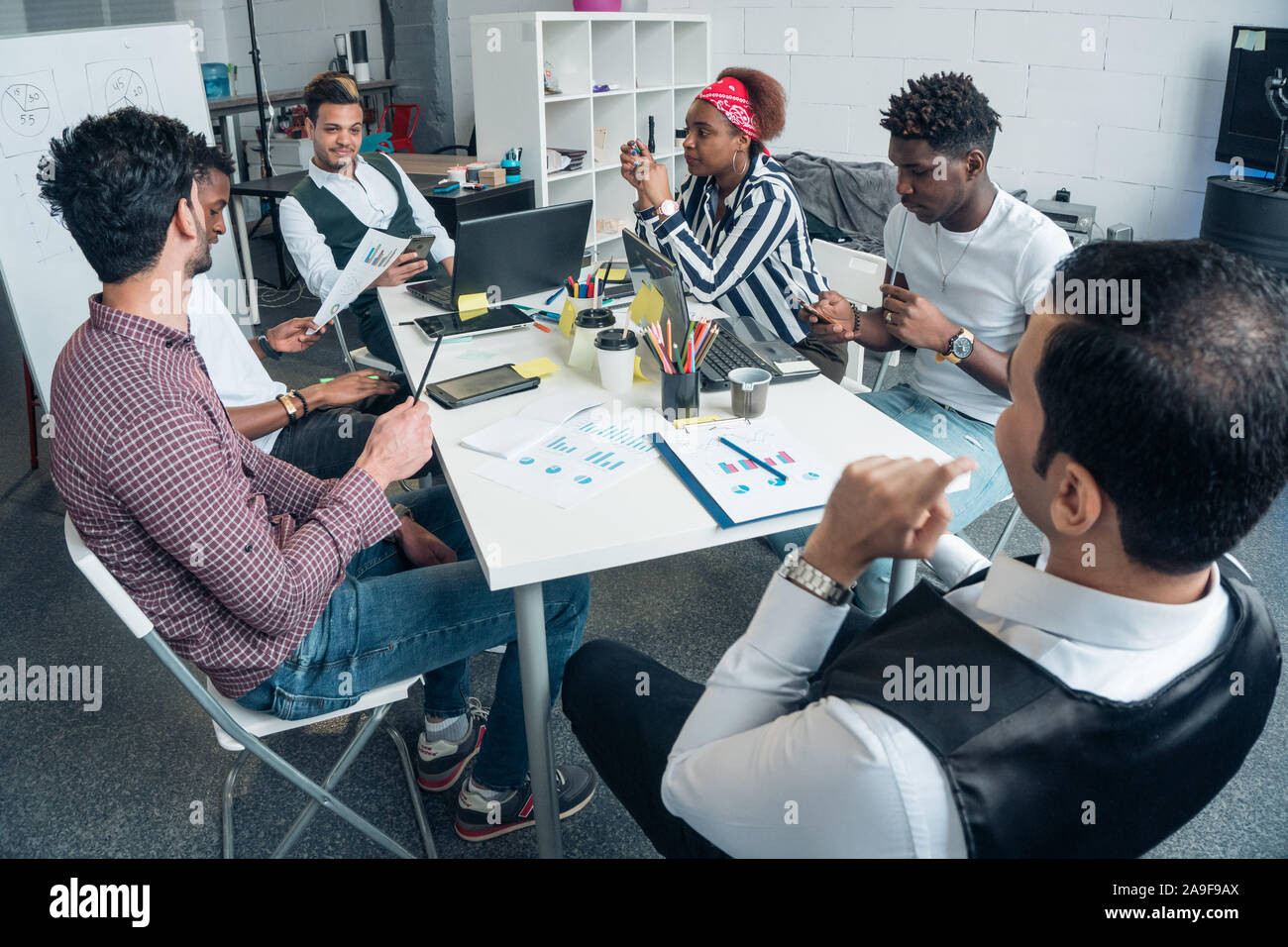 Group promising businessmen discussing hi-res stock photography and ...