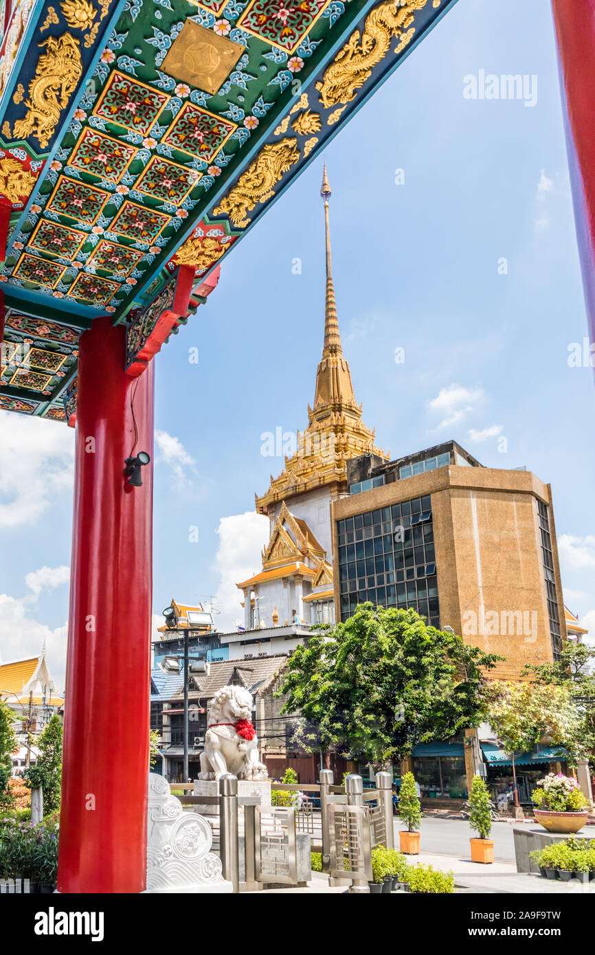 View of the spire of Wat Traimit from underneath the China Gate ...