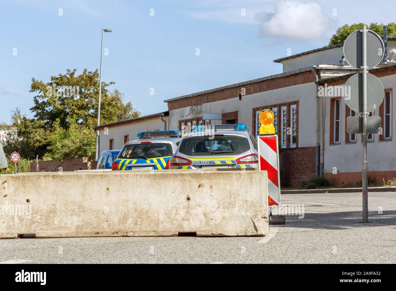 Concrete blocks and police cars to protect against attacks Stock Photo ...