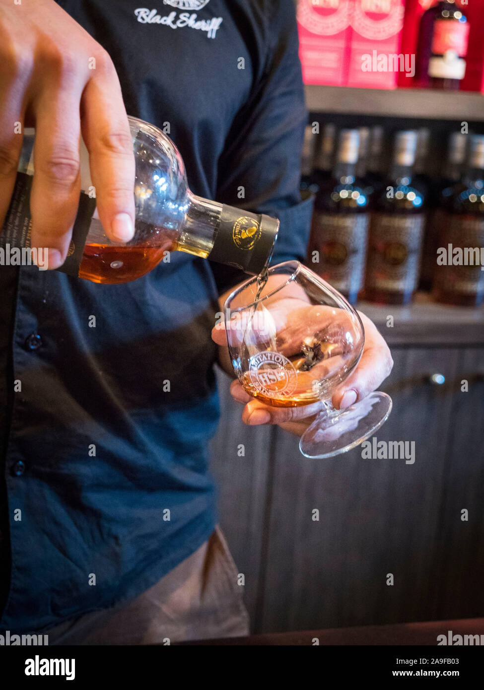 Rhum HSE, rum distillery, tasting, bottle, glass, pour in Stock Photo ...