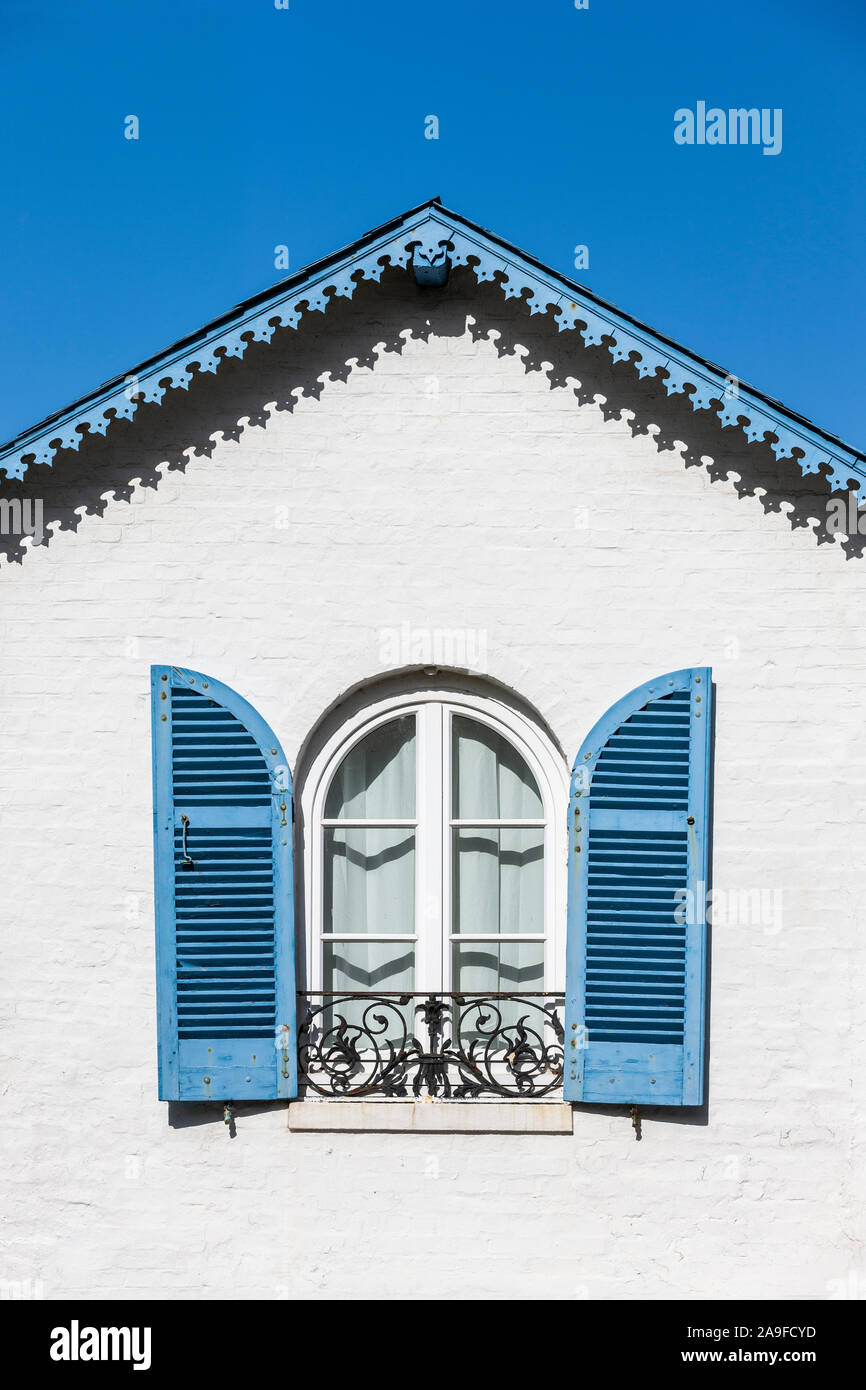 House with blue shutters Stock Photo - Alamy