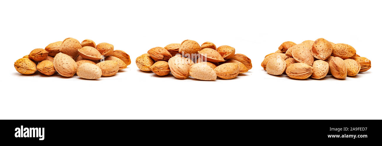 Almonds in the shell isolated on white background Stock Photo - Alamy