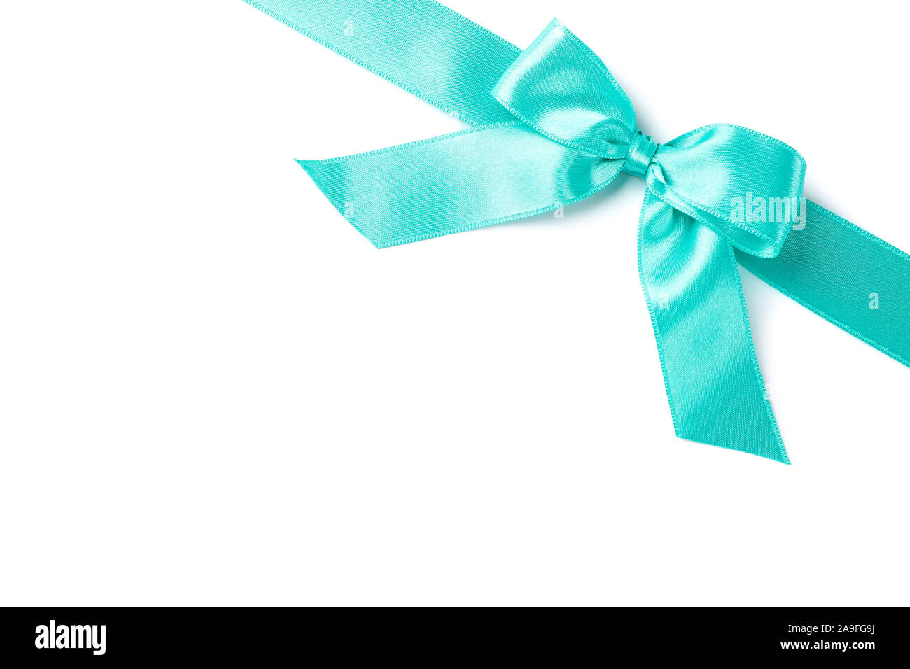 Turquoise ribbon with bow isolated on white background. Gift concept ...